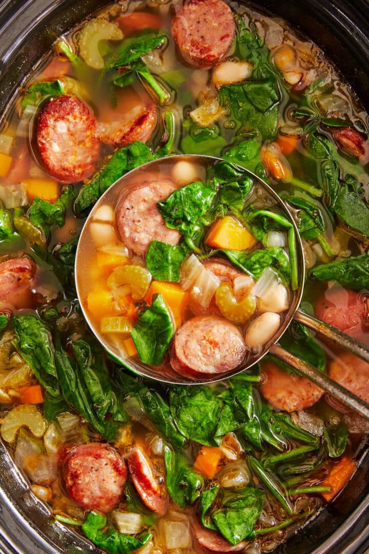 Slow Cooker Sausage Spinach And White Bean Soup Damn Delicious